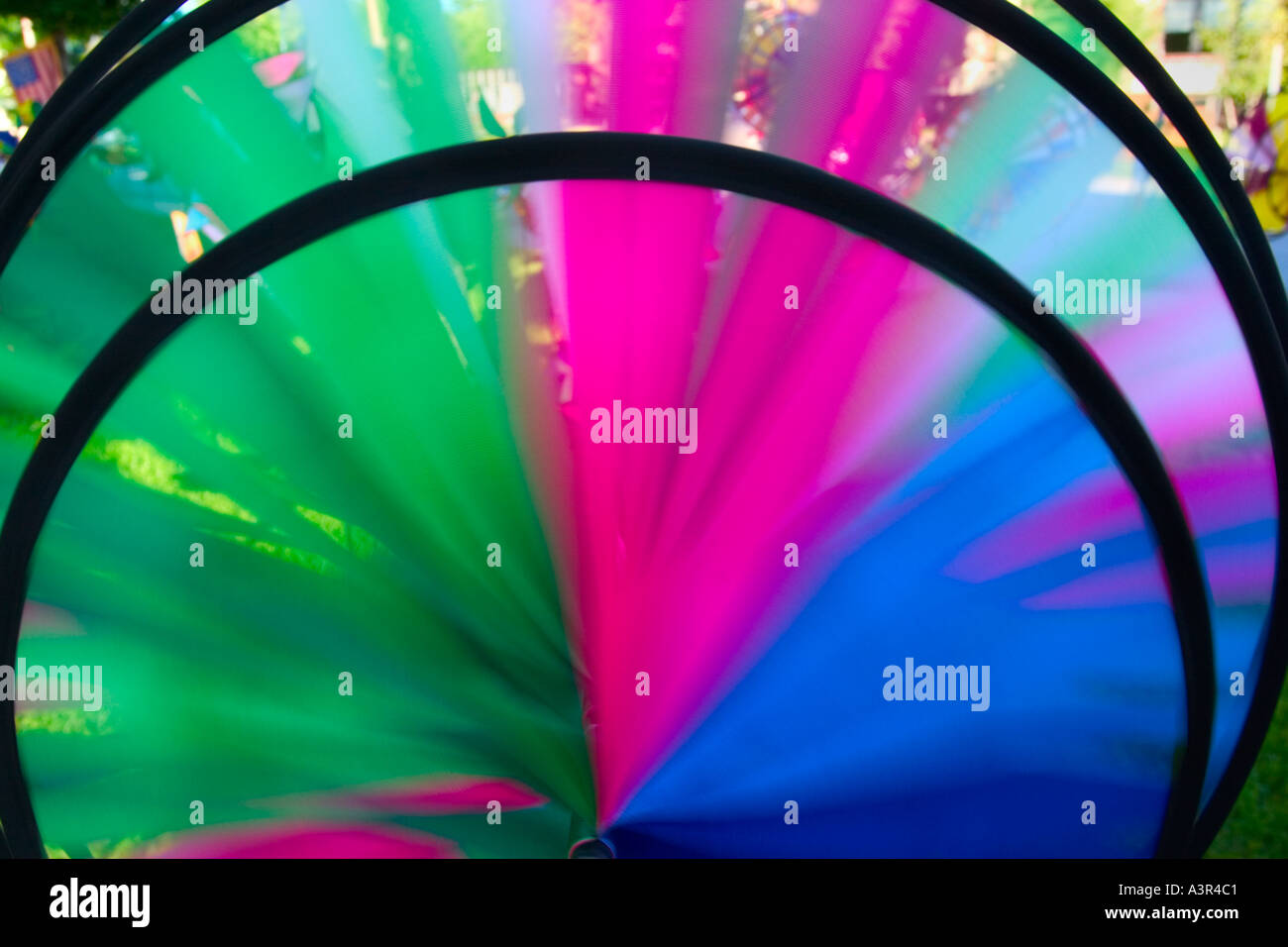 Colorful wind spinners in blurred motion Stock Photo - Alamy