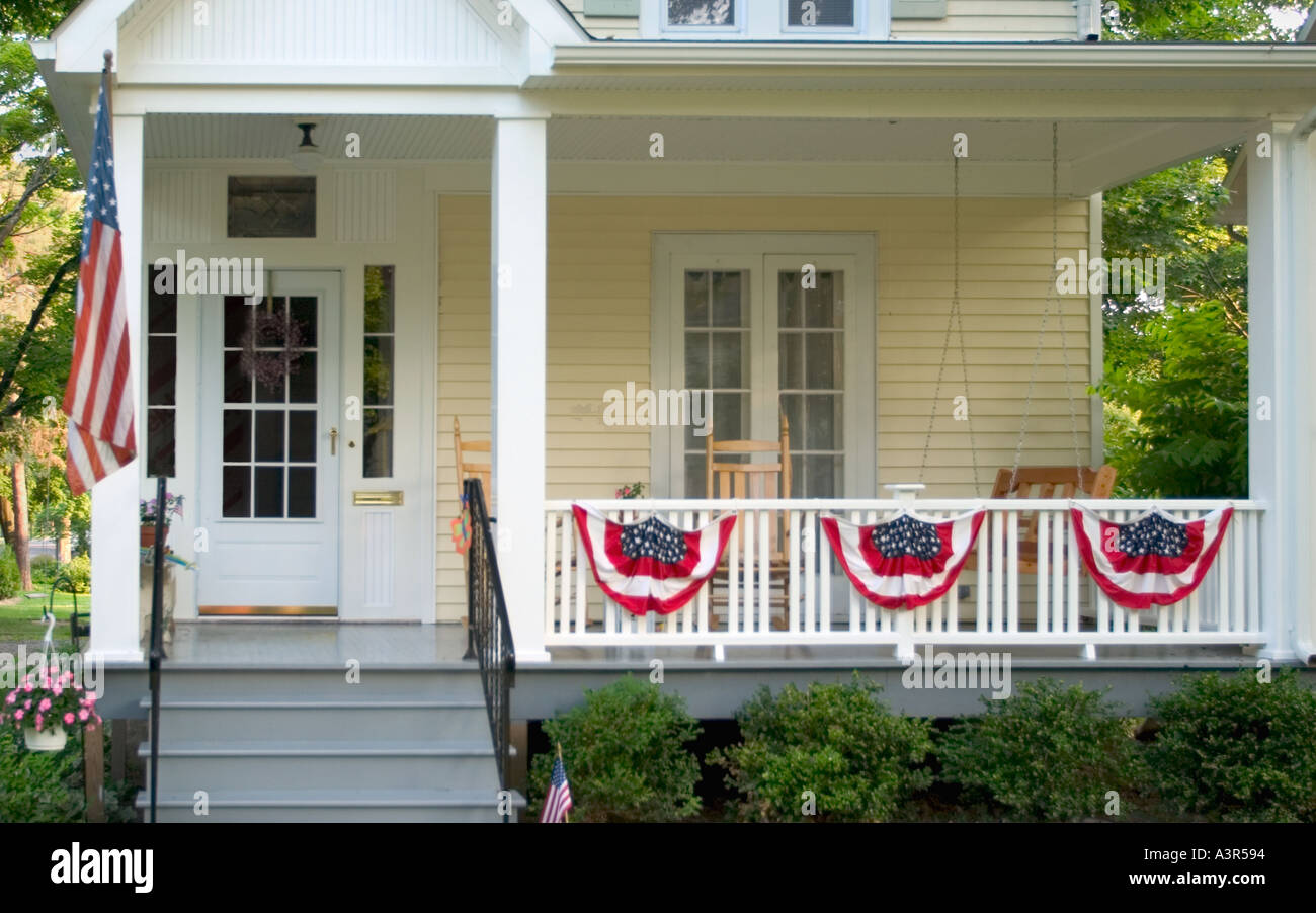 Flags on house porch railing Stock Photo - Alamy