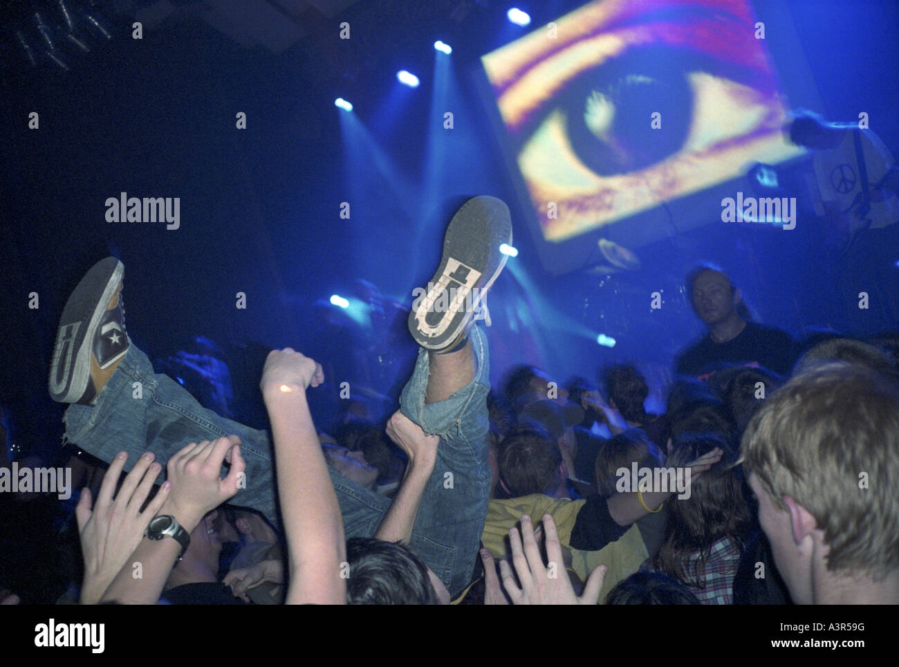 Crowd surfing at a rock concert of the band Kult in Poznan, Poland ...