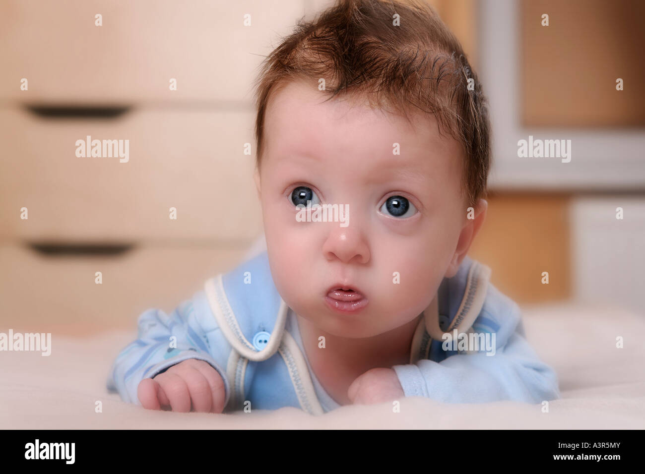 BABY BOY LIFTING HIS HEAD Stock Photo - Alamy