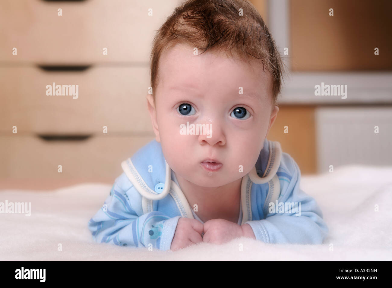 BABY BOY LIFTING HIS HEAD Stock Photo - Alamy