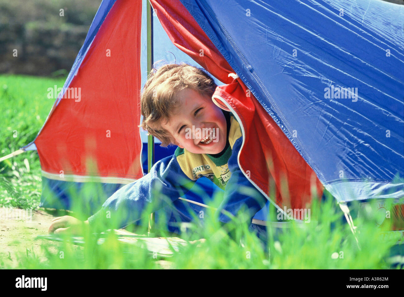 Little boy and tent Stock Photo - Alamy