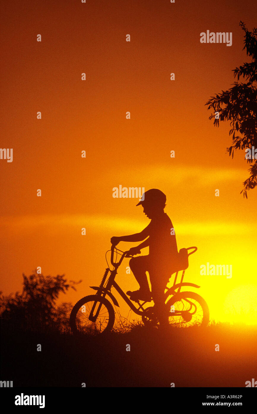 Little boy and sunset Stock Photo - Alamy