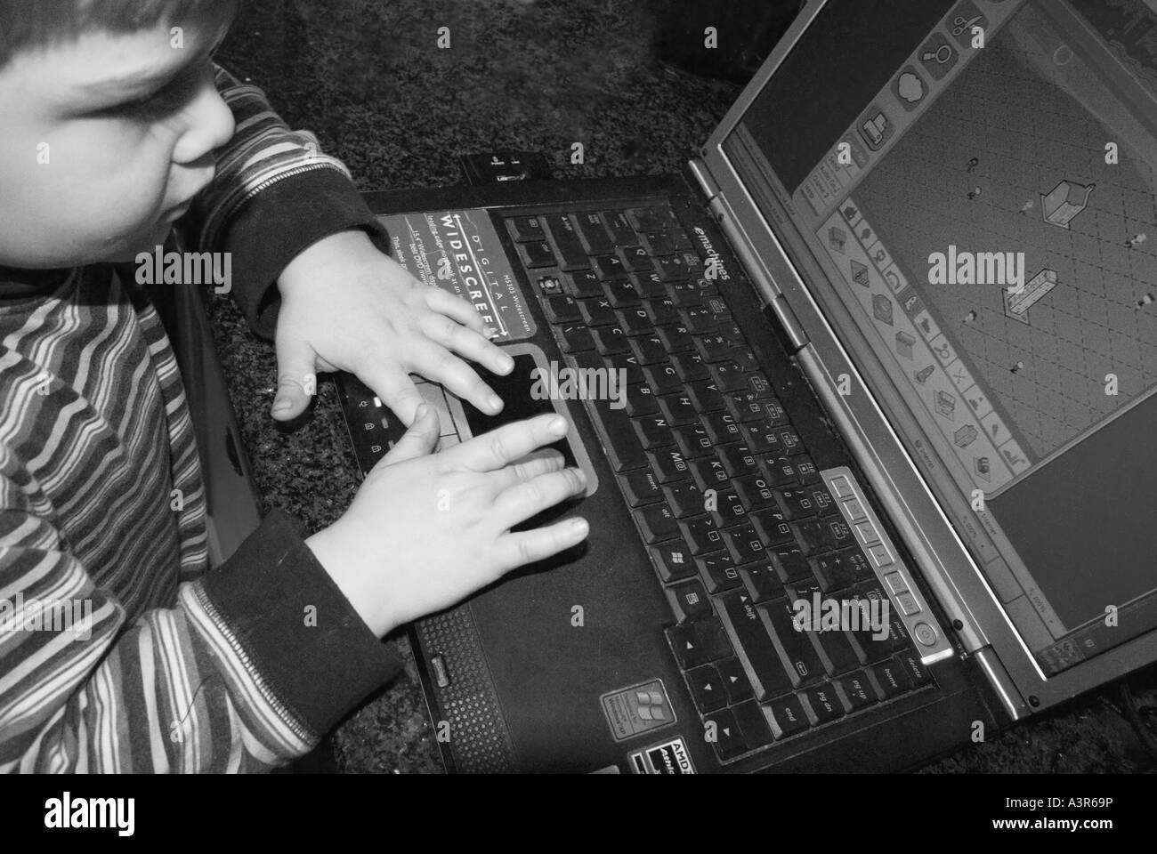child using a laptop black and white picture Stock Photo - Alamy