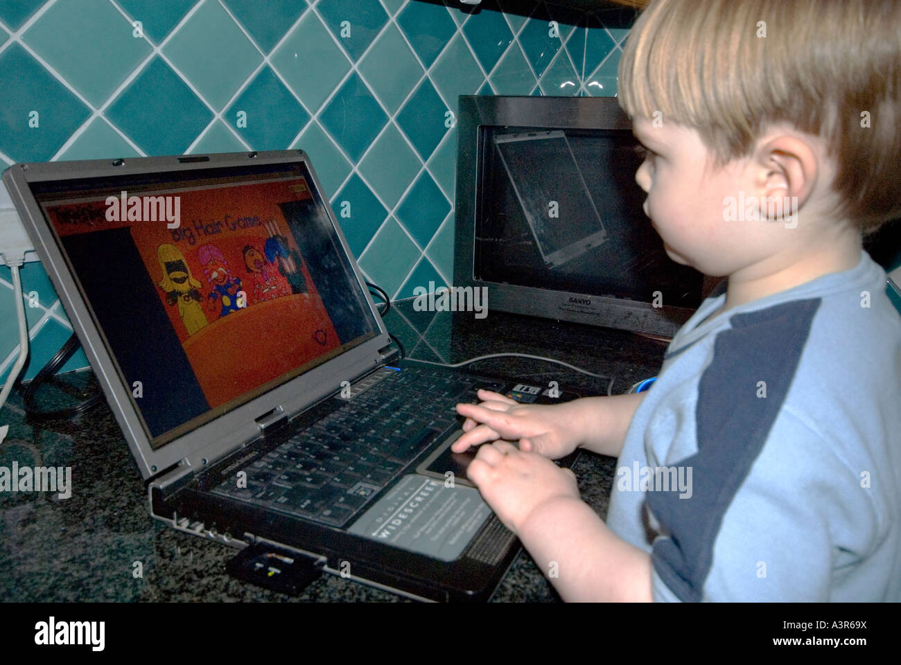 child using a laptop Stock Photo - Alamy