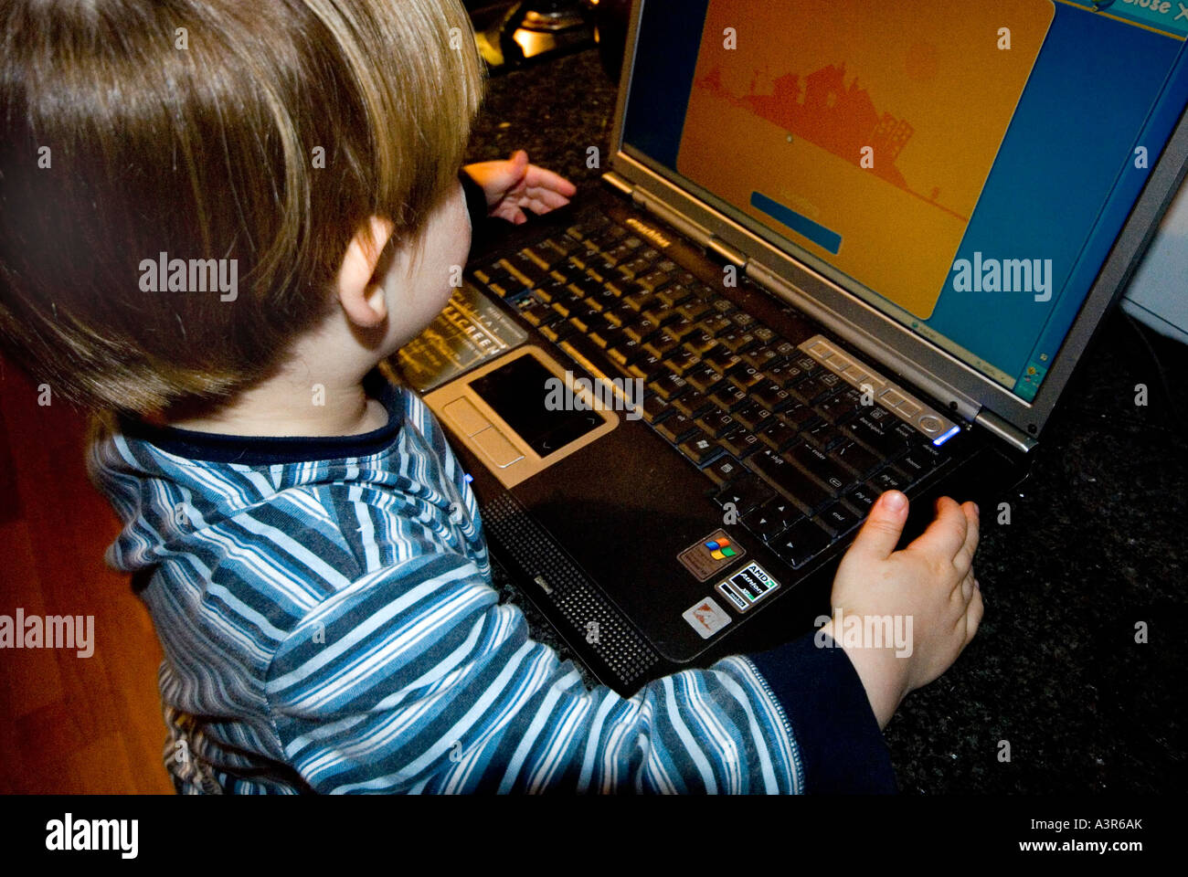 child using a laptop Stock Photo - Alamy