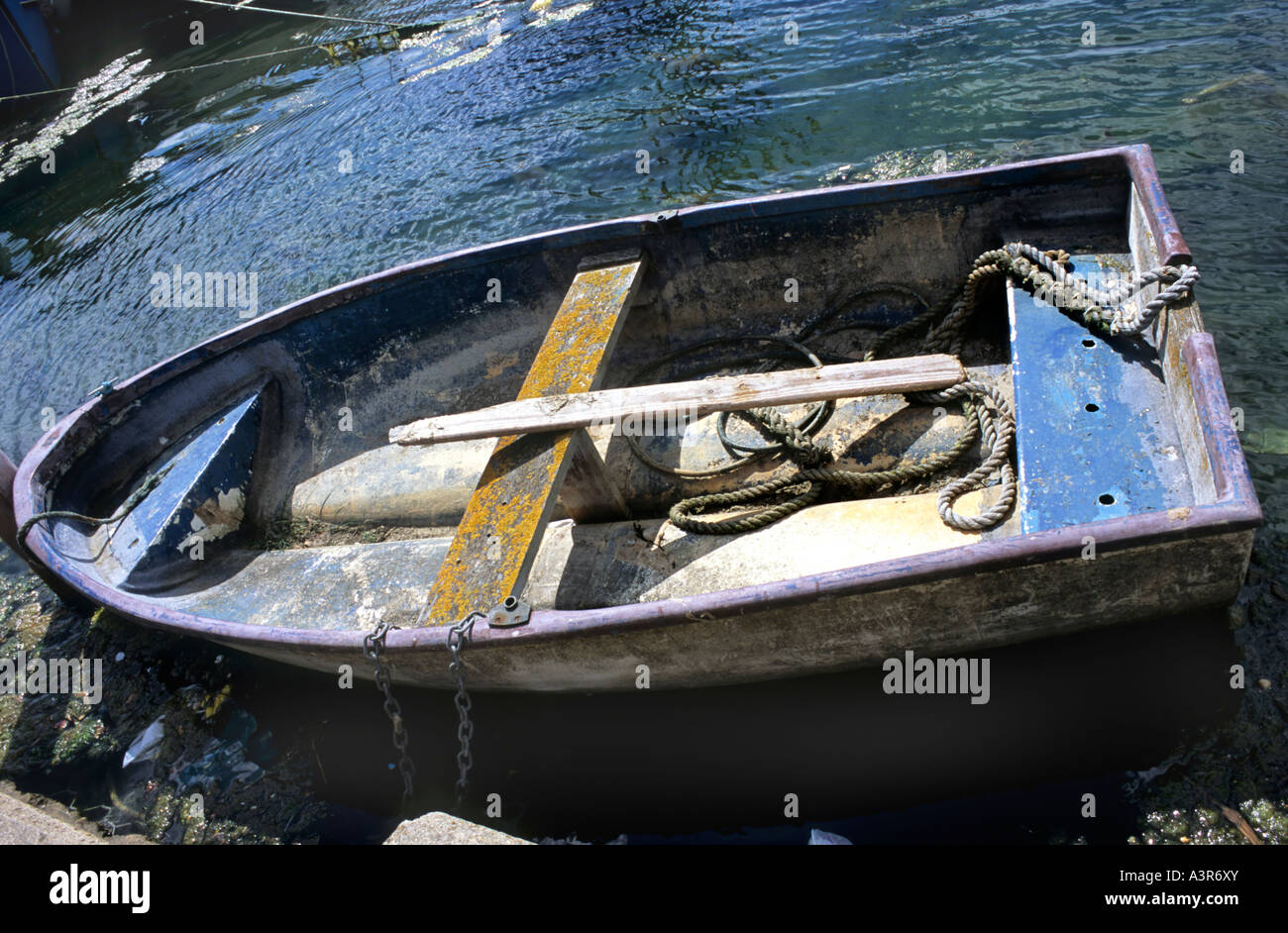 Dingy moored in a marina Stock Photo - Alamy