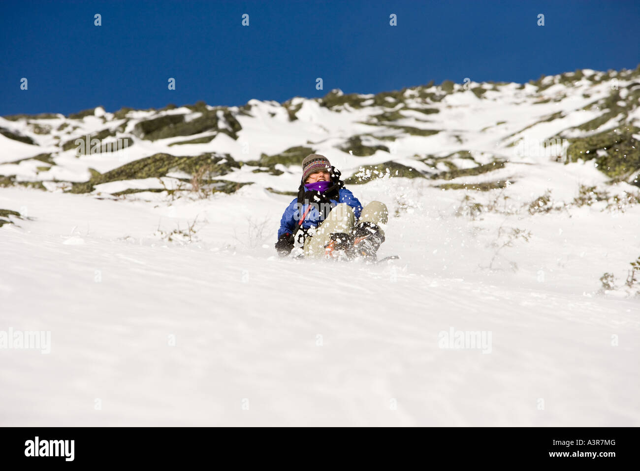 Glissading down a snowfield on the east side of Mount Washington in New ...