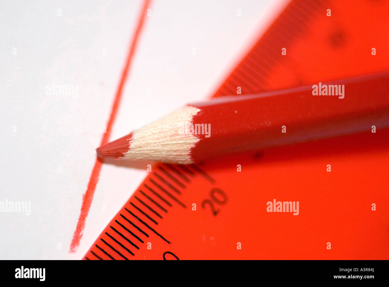 Red ruler pencil and a red line Stock Photo - Alamy