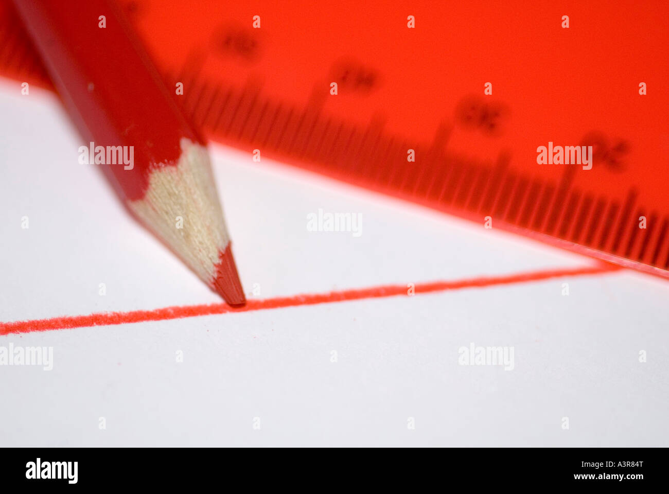 Red ruler pencil and a red line Stock Photo - Alamy