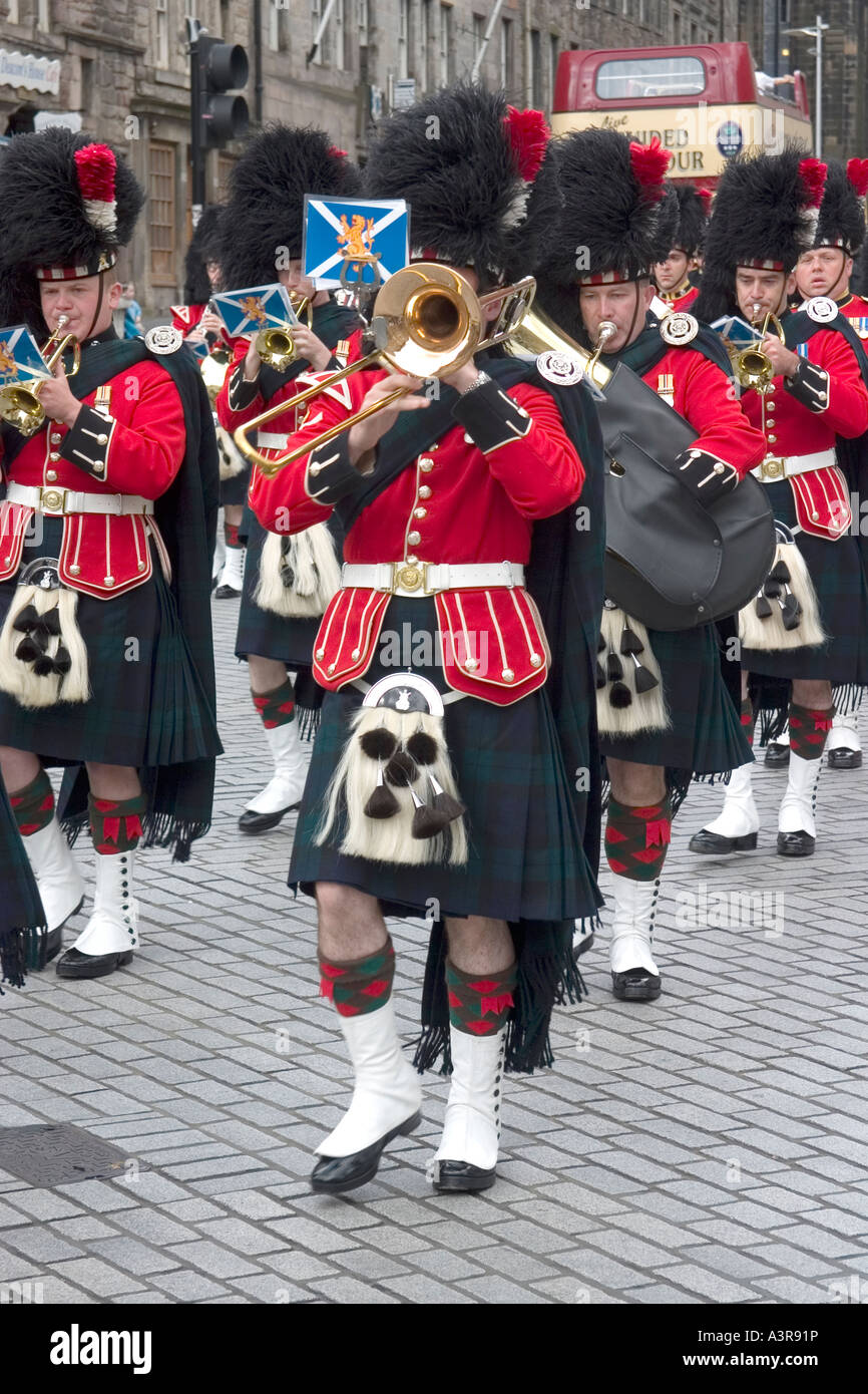 Traditional Scottish military band walking down the Royal Mile in ...
