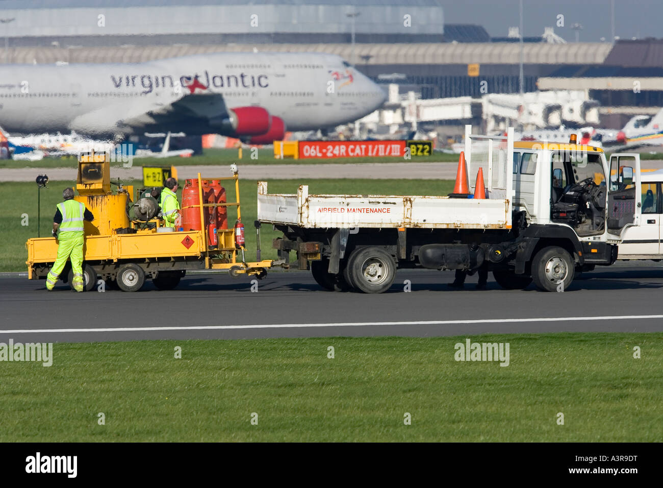 Virgin Atlantic Boeing 747 landing behind airfield maintenance ...