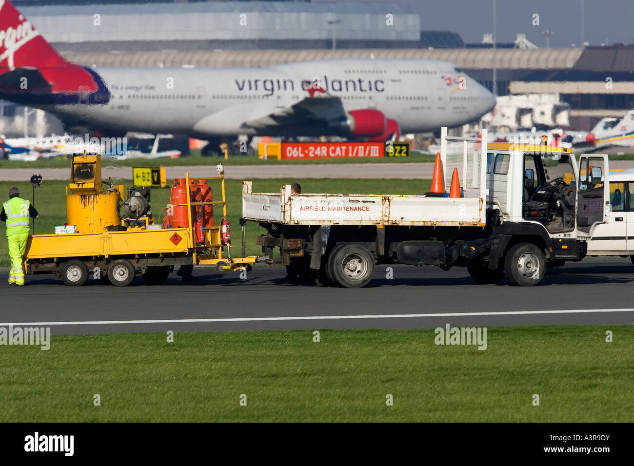 Virgin Atlantic Boeing 747 landing behind airfield maintenance ...