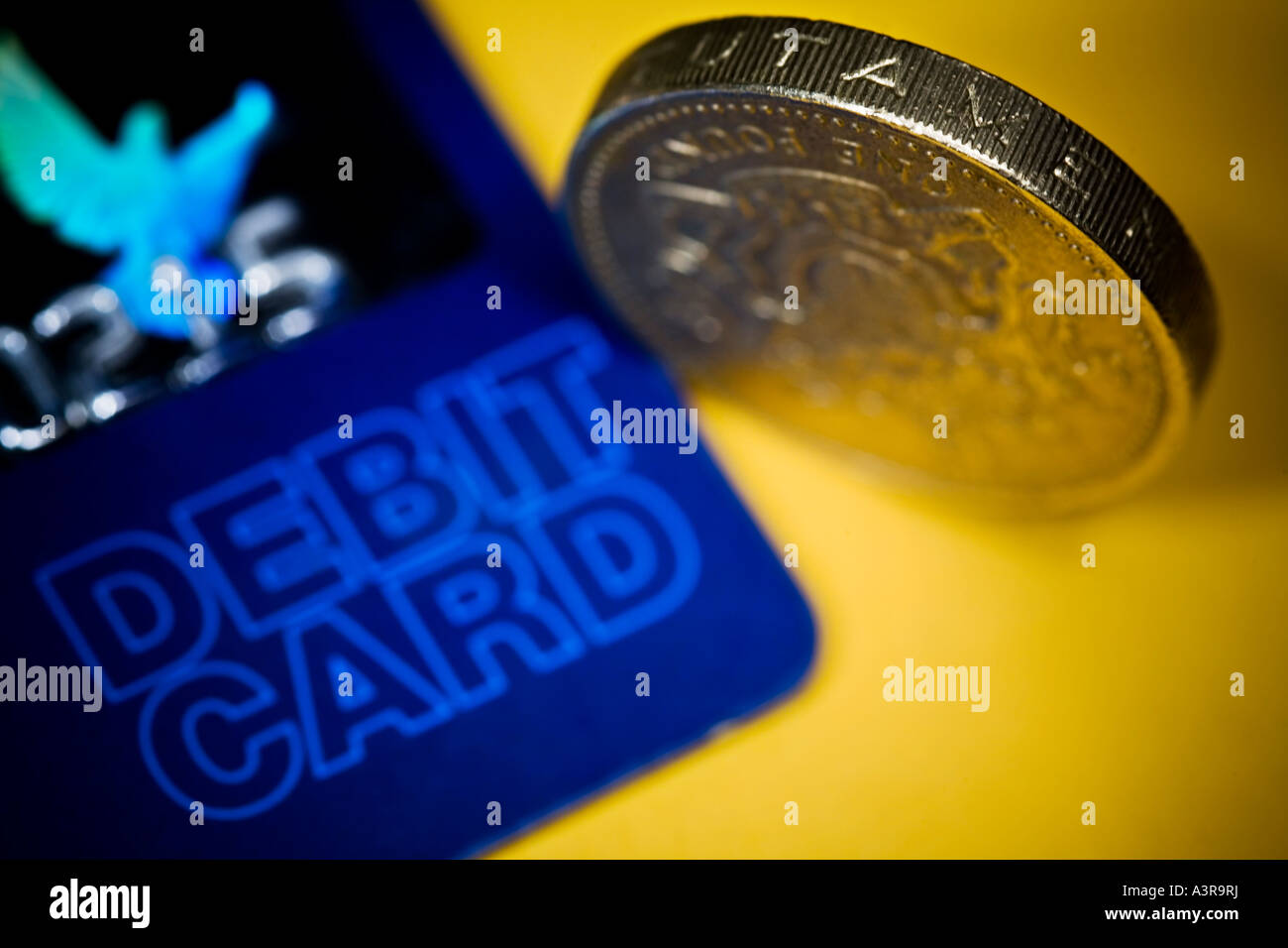 Debit card and pound coin Stock Photo - Alamy