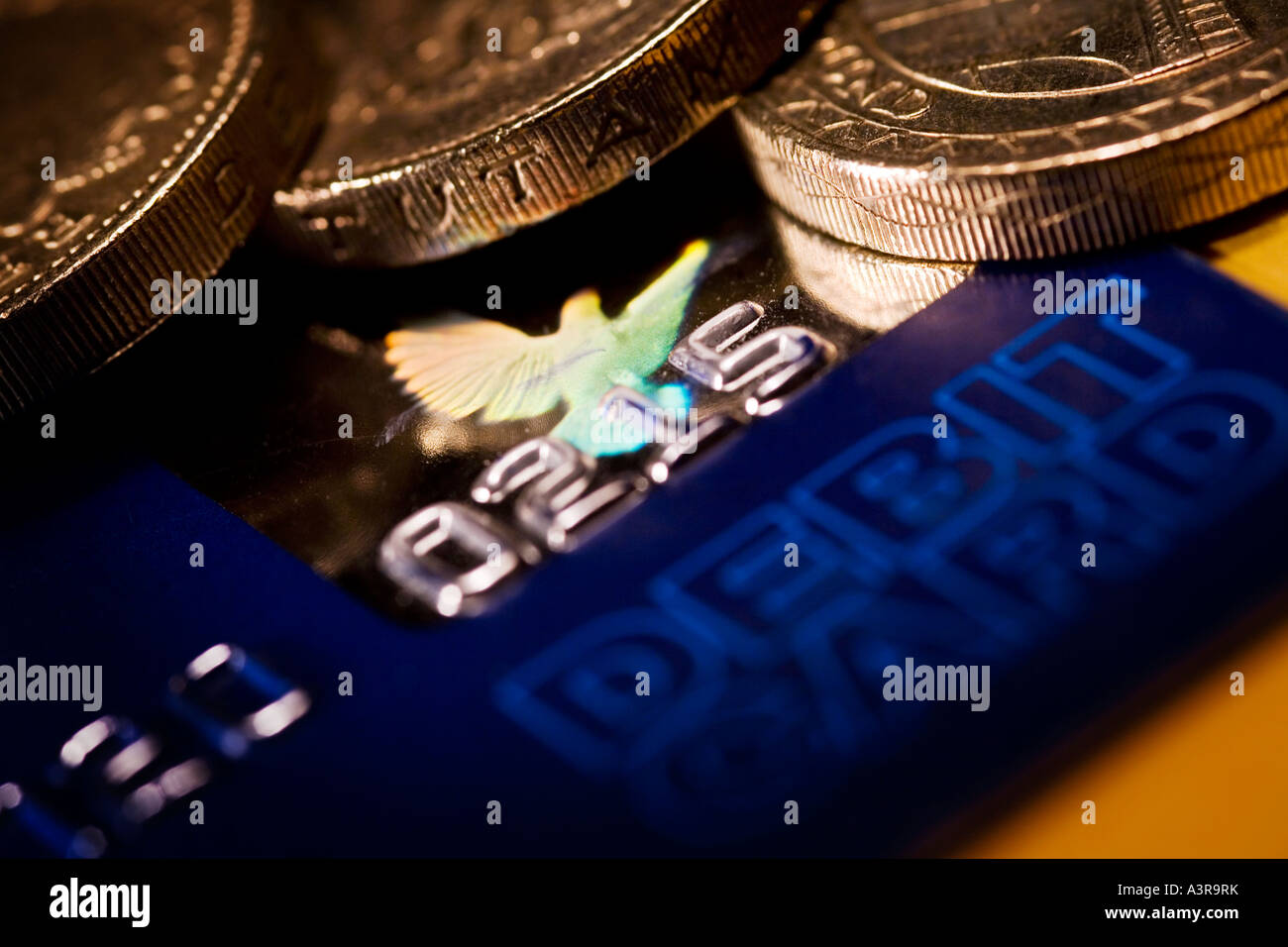 Debit card and pound coins Stock Photo - Alamy