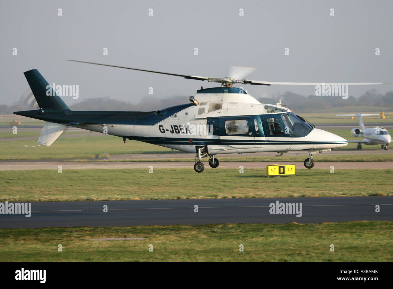 Helicopter taking off at airfield Stock Photo - Alamy