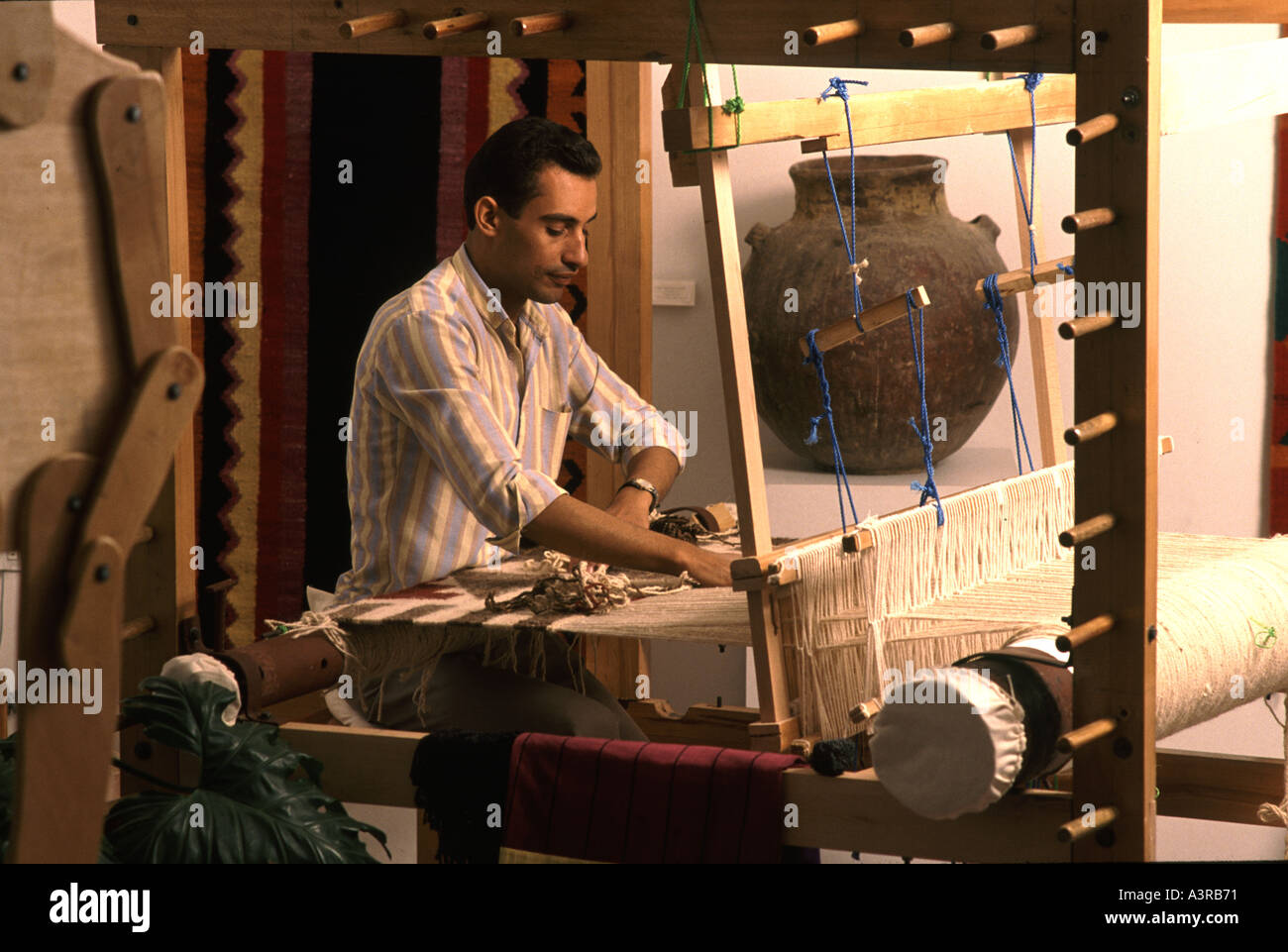Weaving making rug at Handicraft shop in Amman Jordan Stock Photo - Alamy