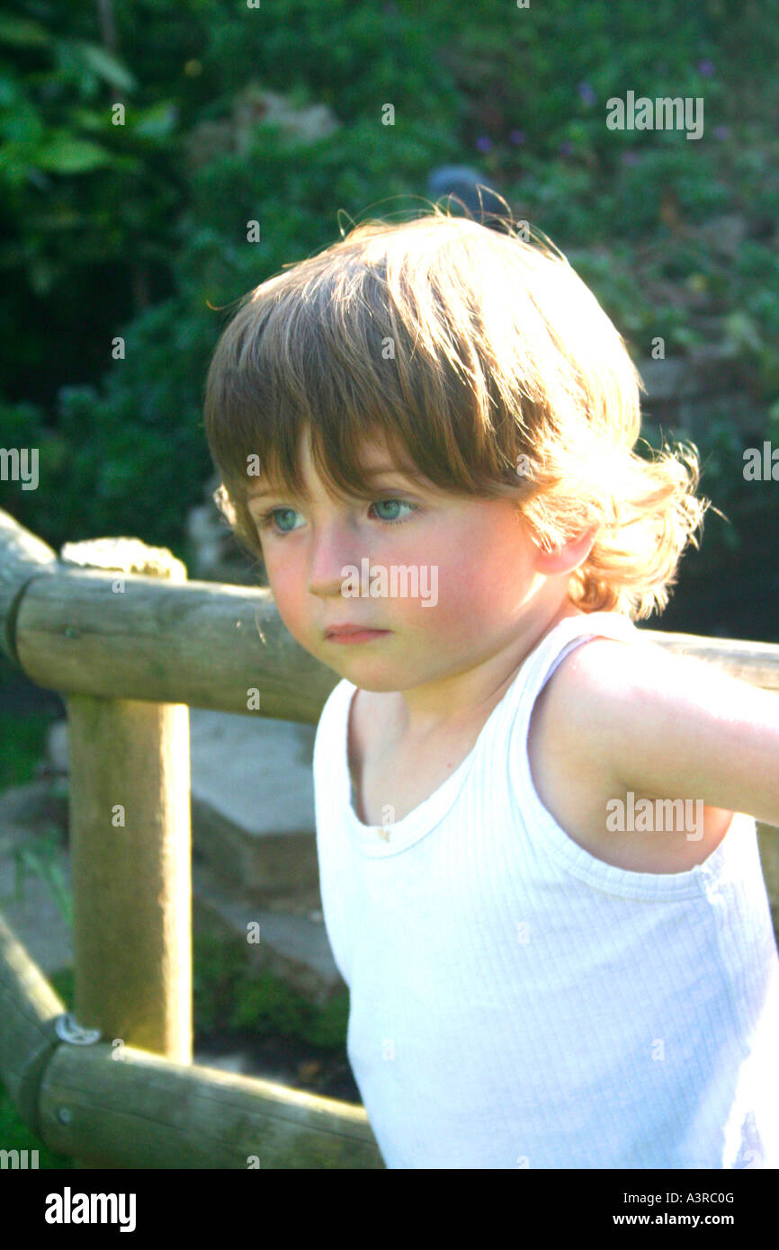 young boy looks lost and sad Stock Photo - Alamy