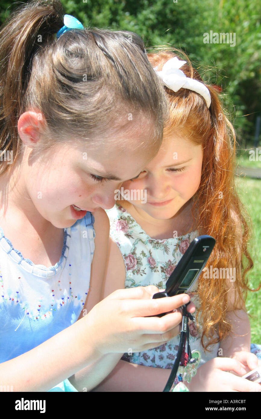 children playing with mobile phone Stock Photo - Alamy