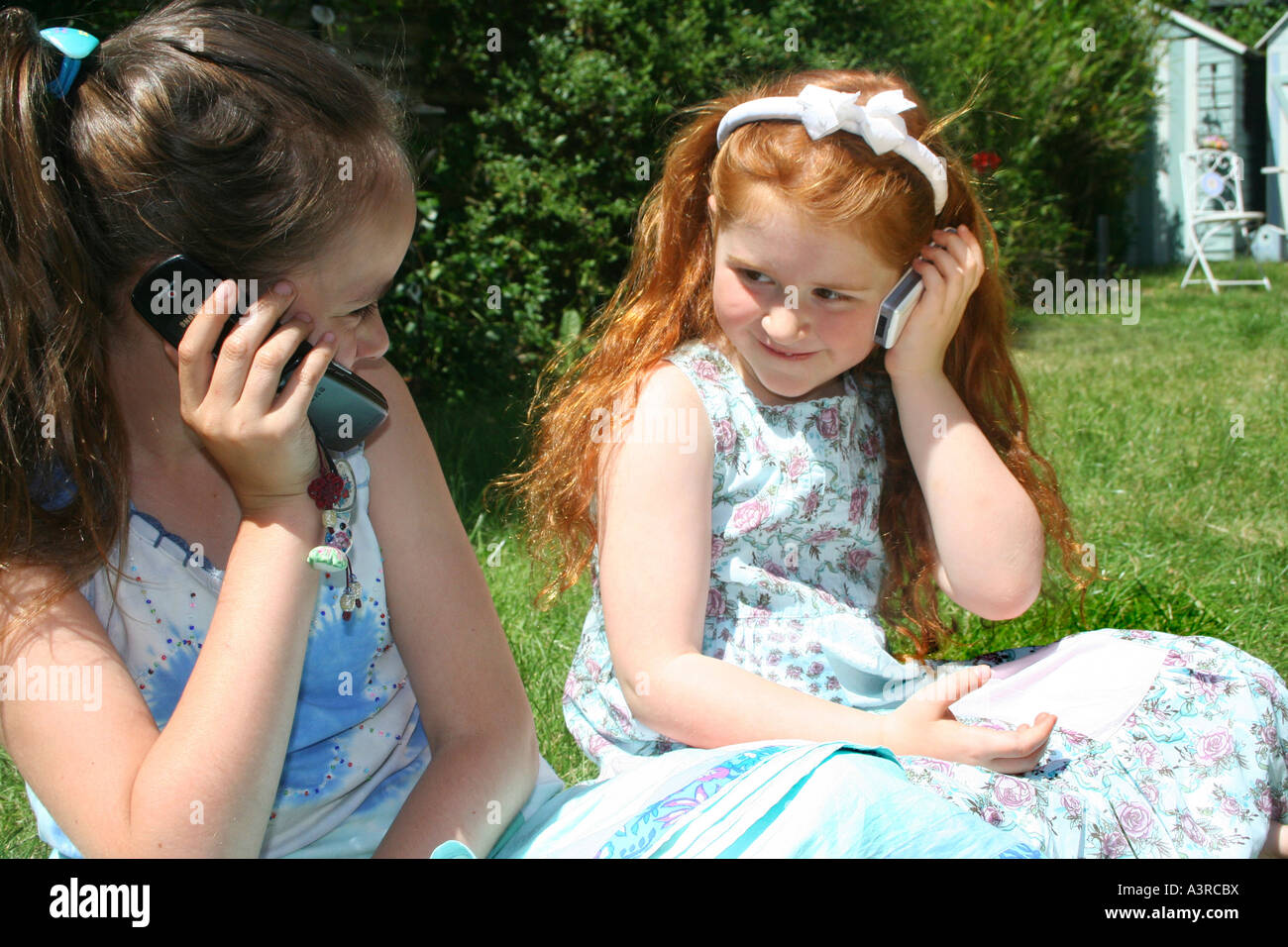children talking on mobile phones Stock Photo - Alamy