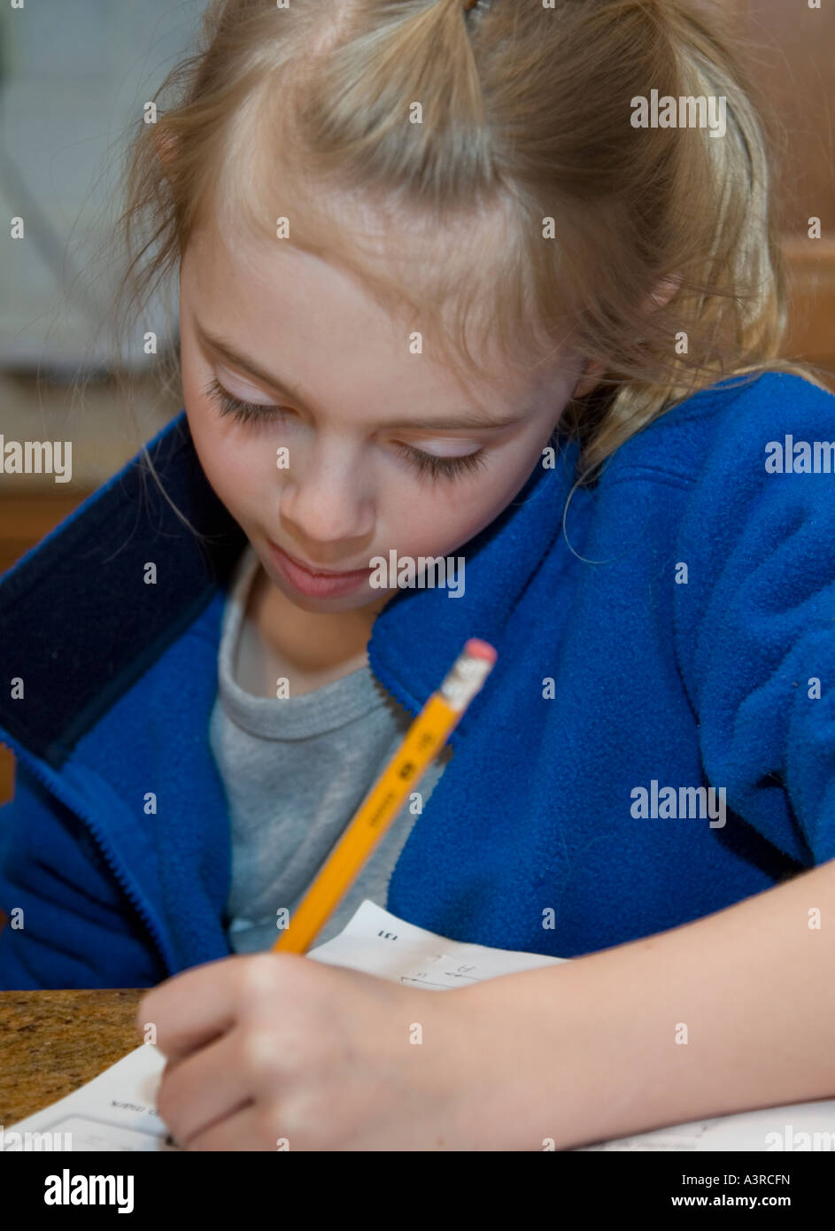 Young girl doing her homework Stock Photo - Alamy