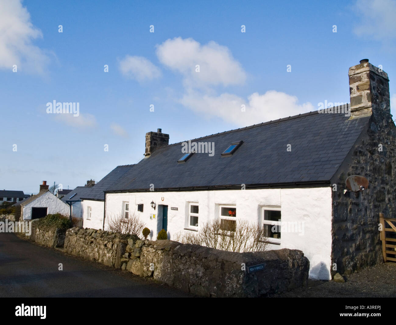 Traditional single storey traditional white washed stone cottage with ...