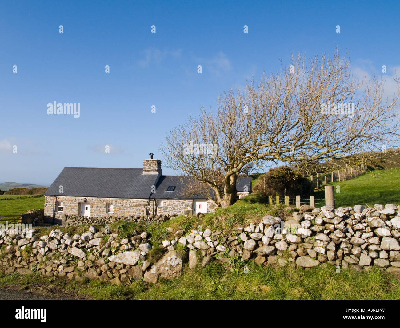 Traditional single storey traditional stone cottage with slate roof ...