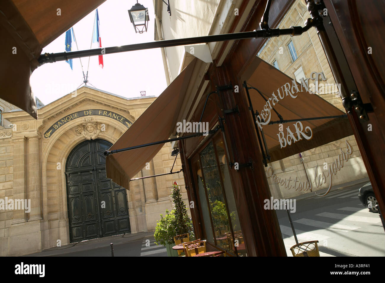 Facade of a typical Paris cafe close to an entrance to the French ...