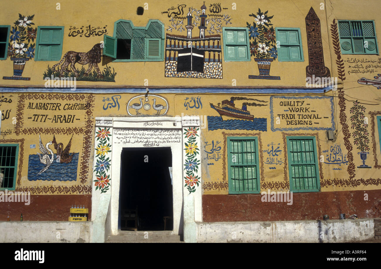 A house decorated with murals of the Holy City of Mecca indicates the ...