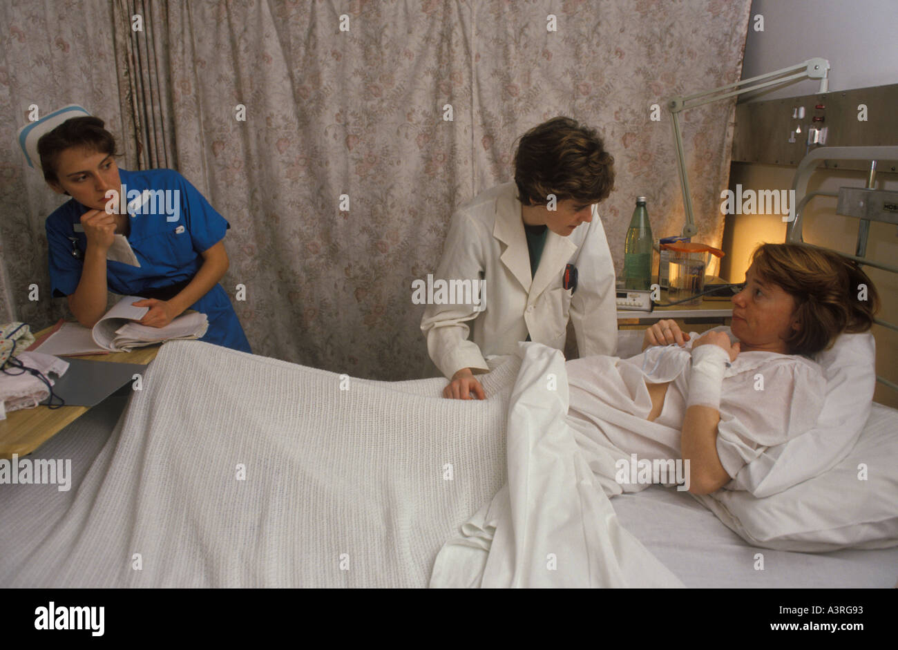NHS 1980s Dr Maura Stafford female doctor attends patient Royal United ...