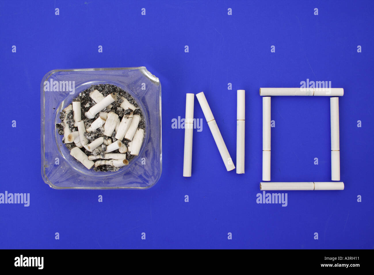 A NO SMOKING SIGN ASHTRAY AND CIGARETTES Stock Photo - Alamy