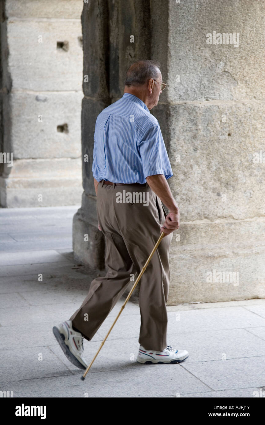 Old man walking with a cane Stock Photo - Alamy