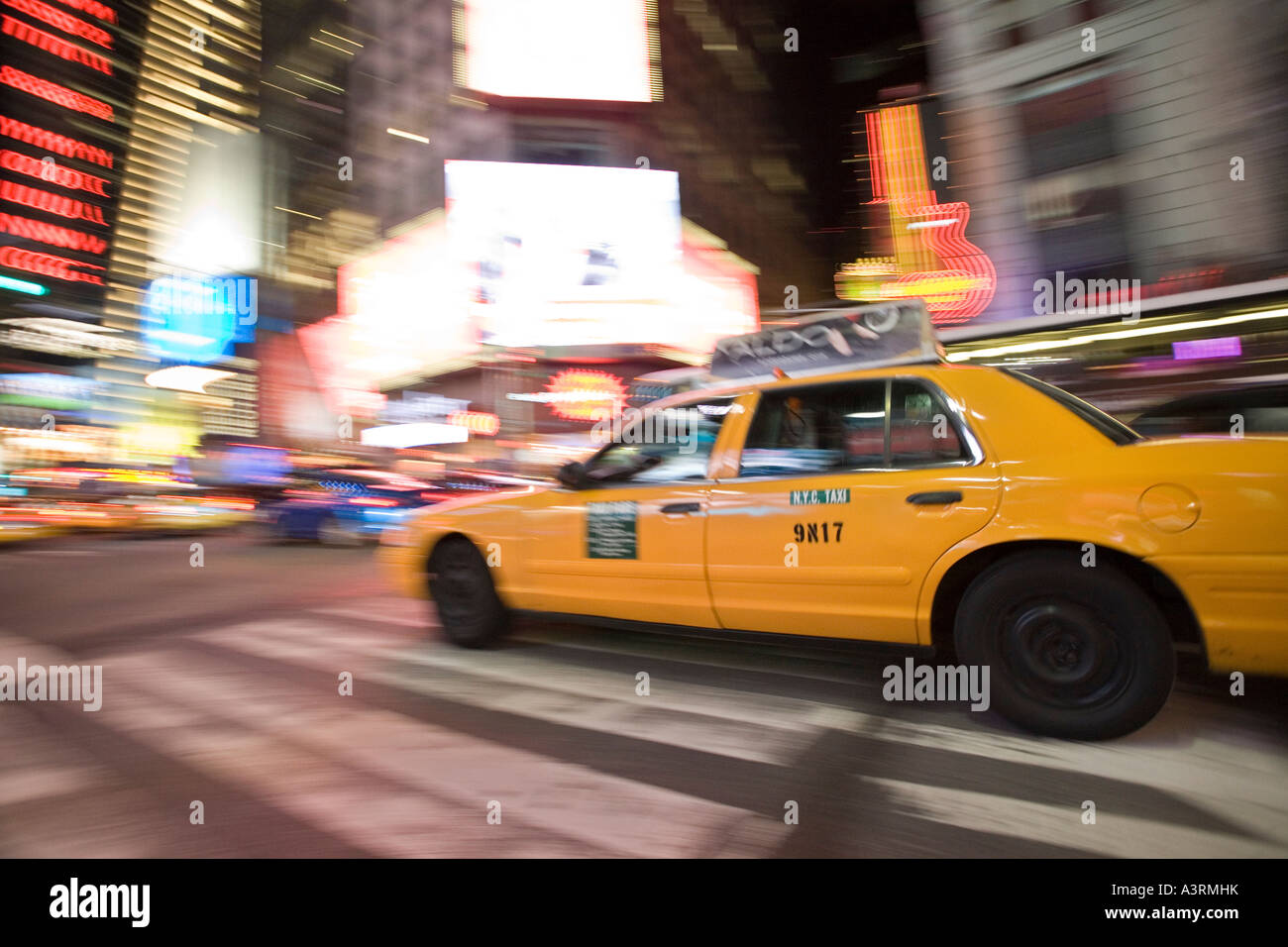 Yellow taxi cab night panning blur hi-res stock photography and images ...
