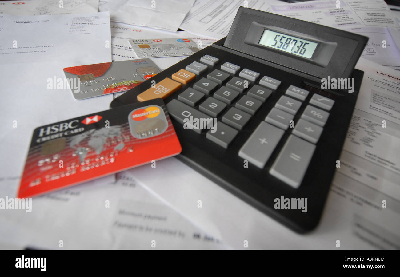 BRITISH CREDIT CARDS WITH CALCULATOR AND BILLS.UK Stock Photo - Alamy