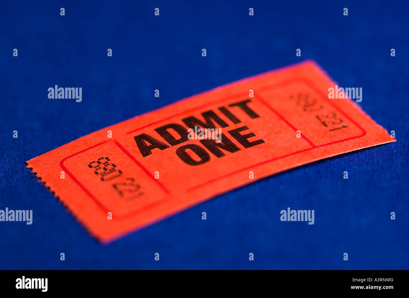 A ticket on a blue background Stock Photo - Alamy