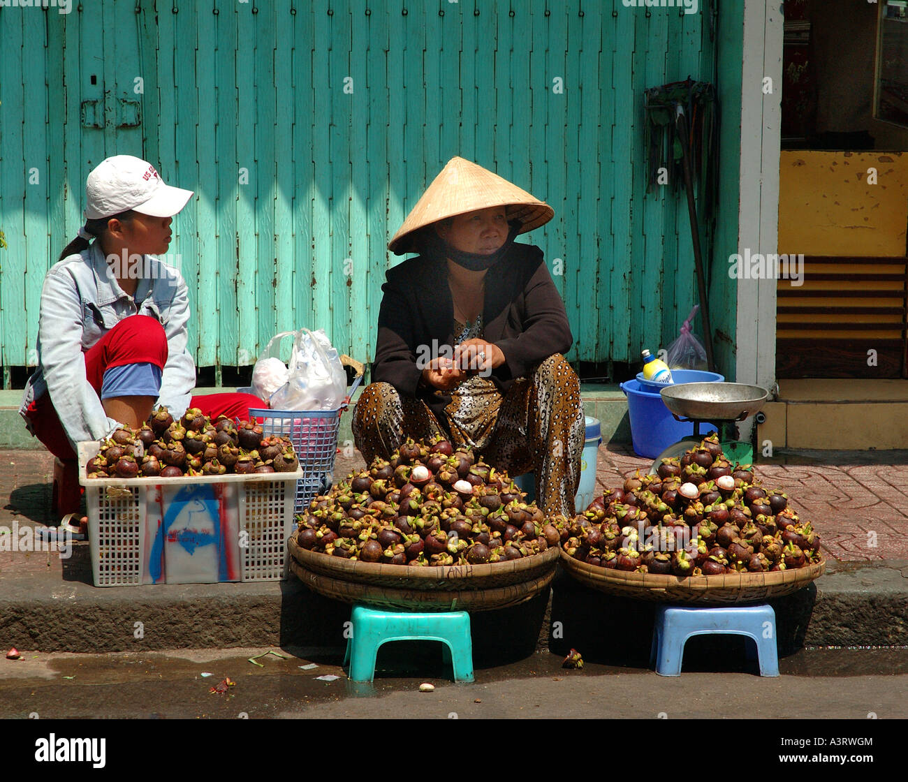 Stock photo of women selling mangosteen in Saigon. 2005 Stock Photo - Alamy