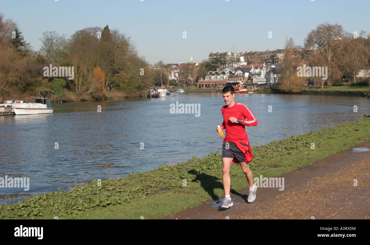 man jogging by riverside Stock Photo - Alamy