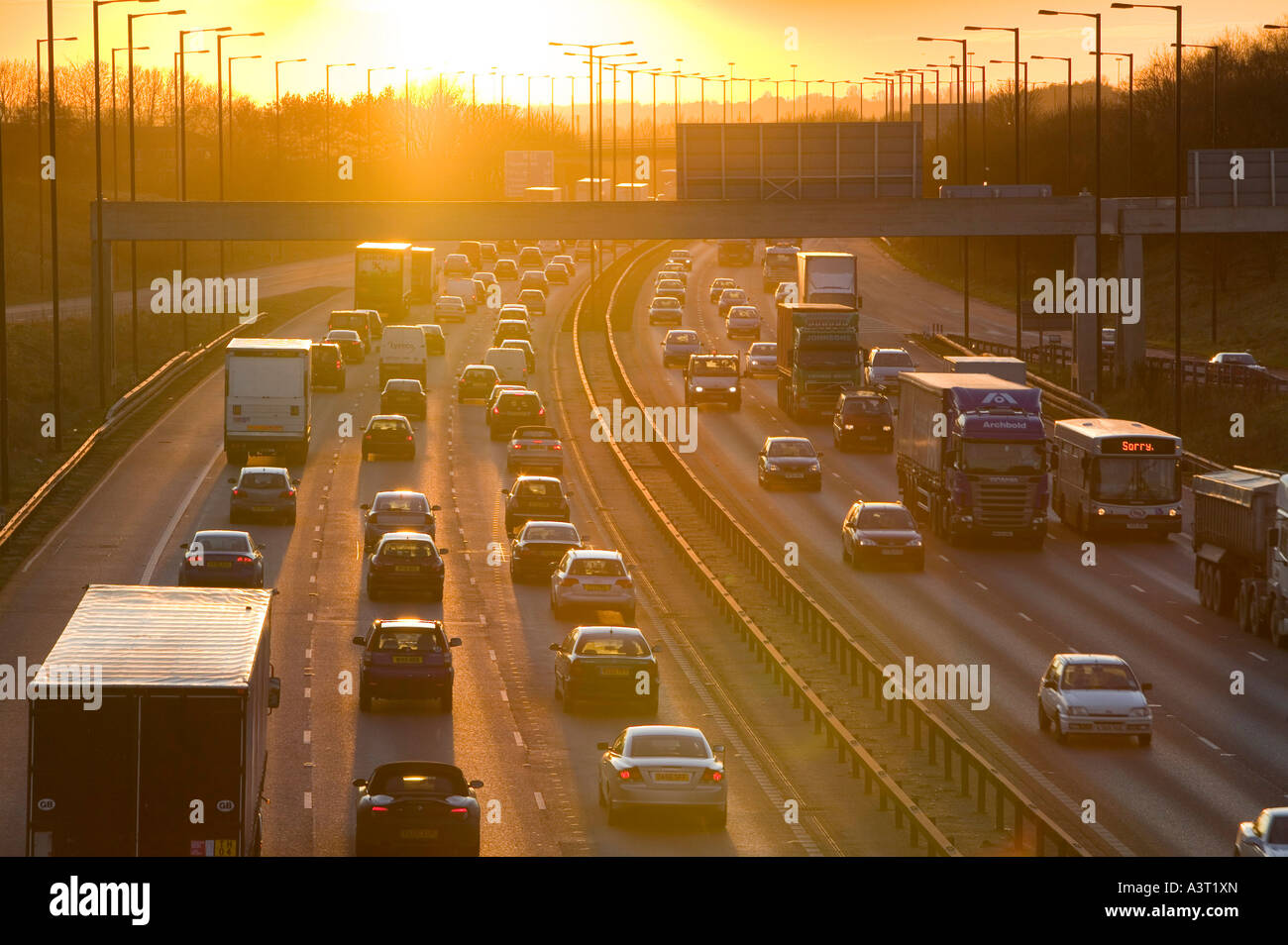 rush hour traffic on the M60 motorway near Manchester at sunset, UK ...