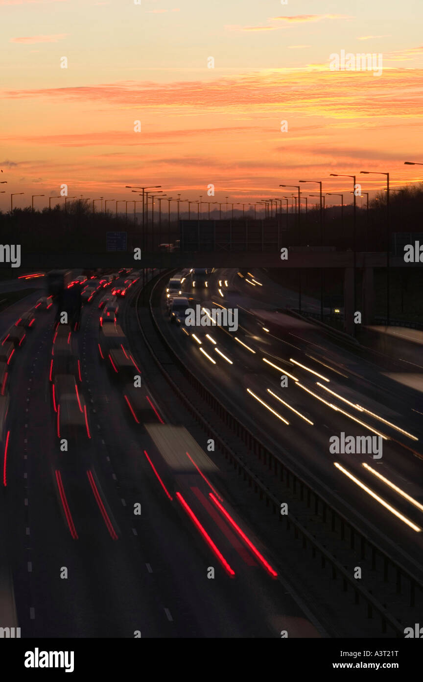 rush hour traffic on the M60 motorway near Manchester at sunset, UK ...