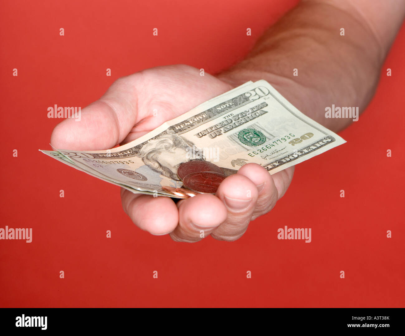 Man's hand holding money Stock Photo - Alamy