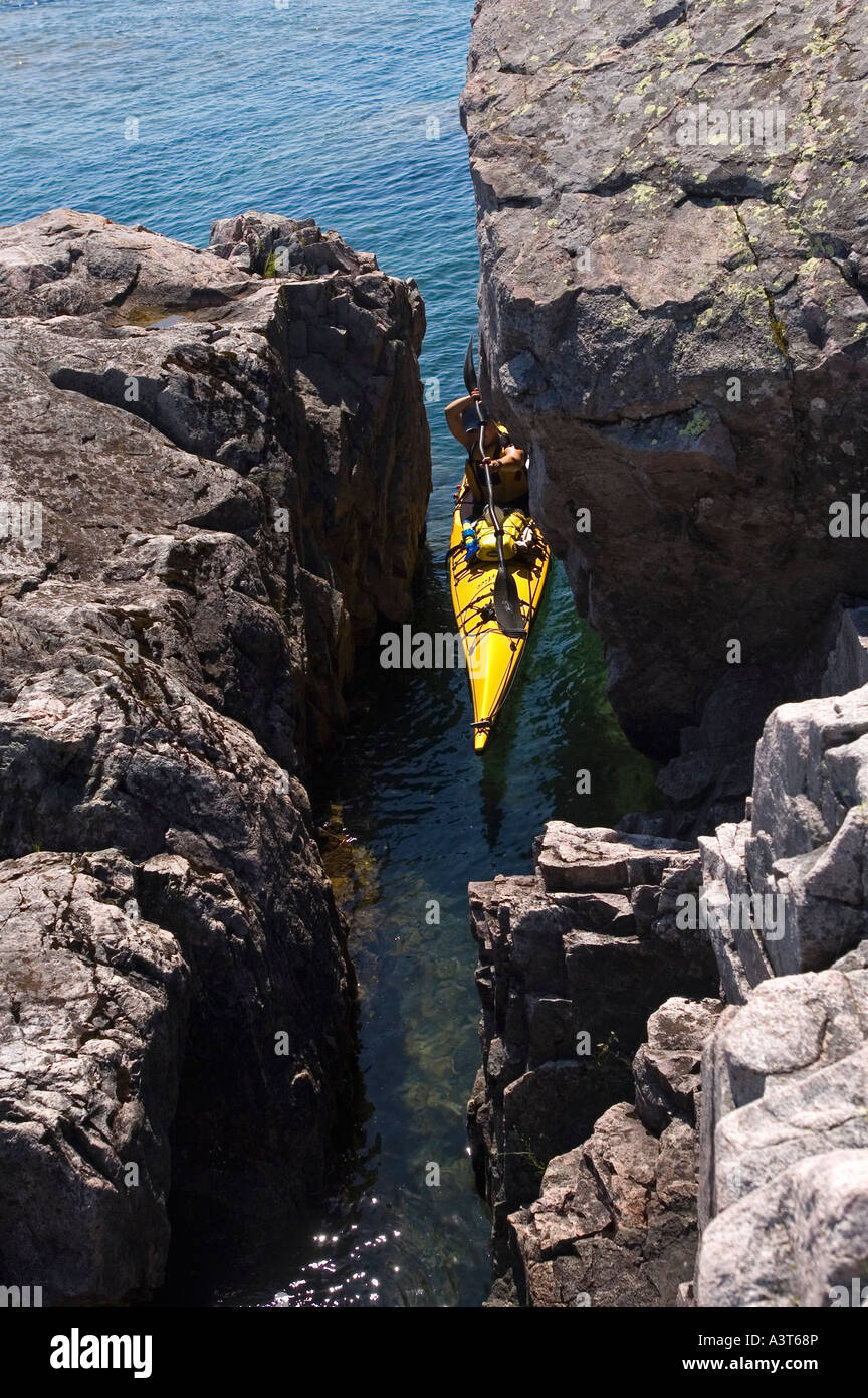 A sea kayaker explores Granite Point on Lake Superior between Big Bay ...