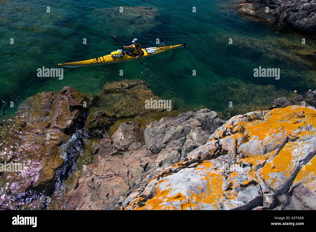 A sea kayaker explores Granite Point on Lake Superior between Big Bay ...