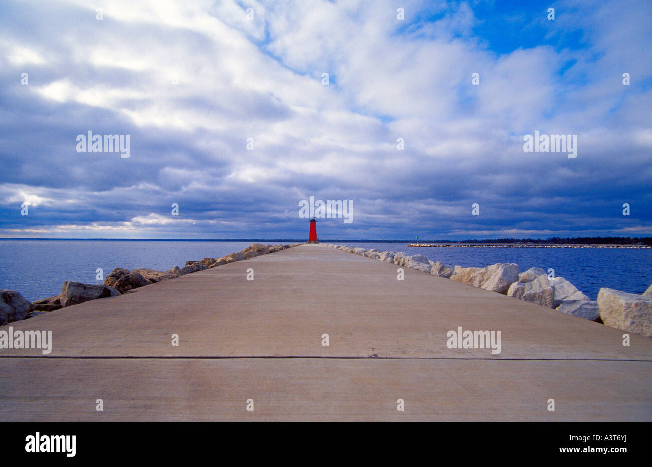 THE MANISTIQUE LIGHTHOUSE AND BREAKWATER AT THE MOUTH OF THE MANISTIQUE ...