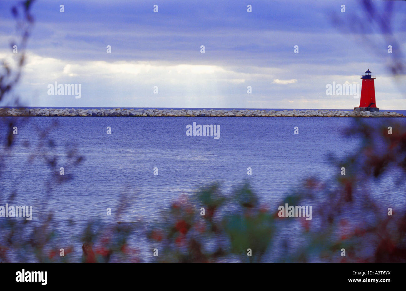 THE MANISTIQUE LIGHTHOUSE AND BREAKWATER AT THE MOUTH OF THE MANISTIQUE ...