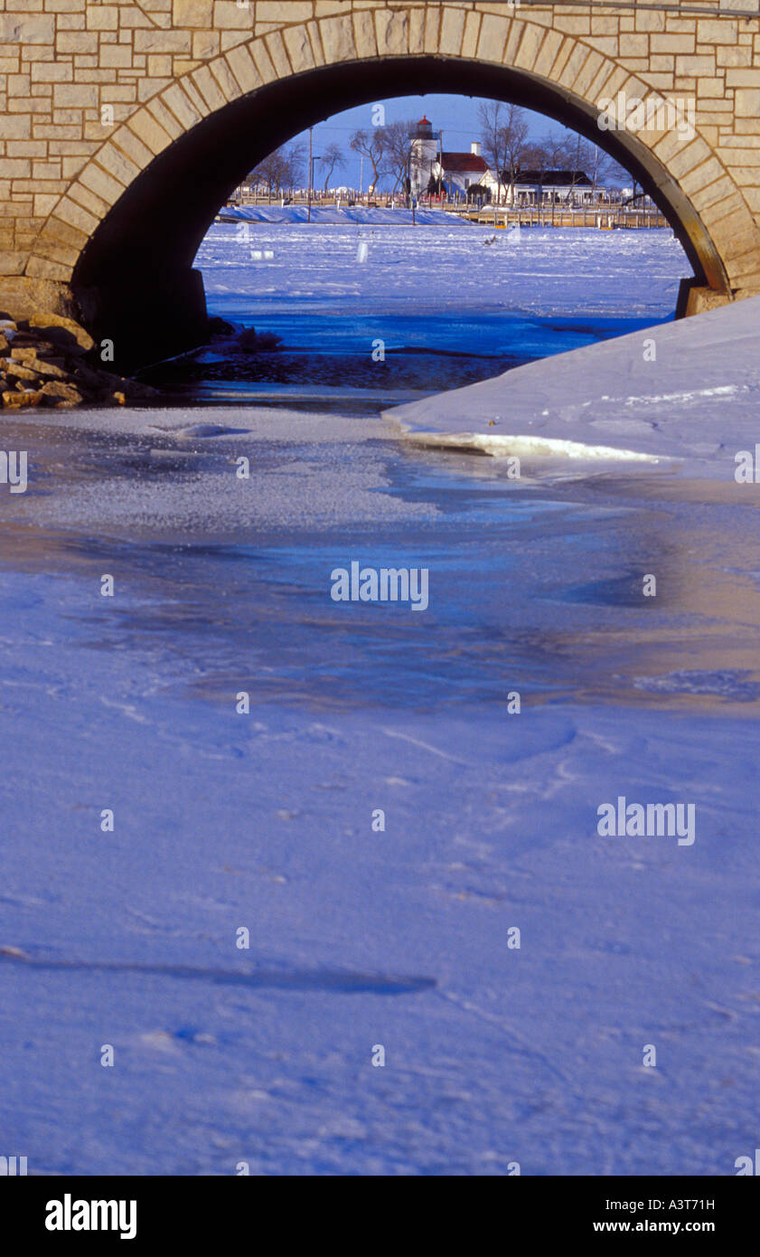 SAND POINT LIGHTHOUSE SEEN THROUGH AN OPENING IN A BRIDGE AT LUDINGTON ...