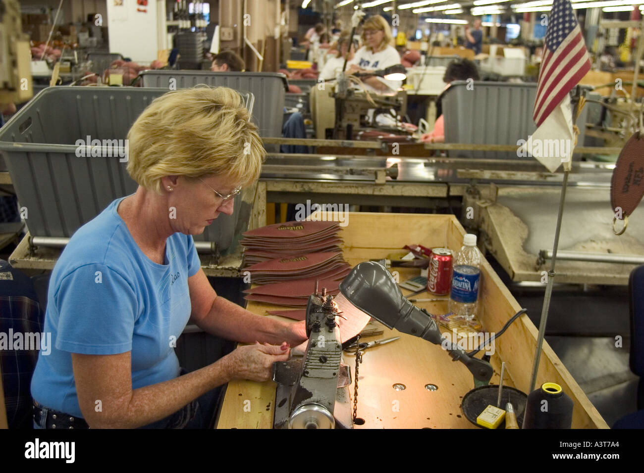 Workers manufacture footballs at Wilson Sports factory Stock Photo - Alamy