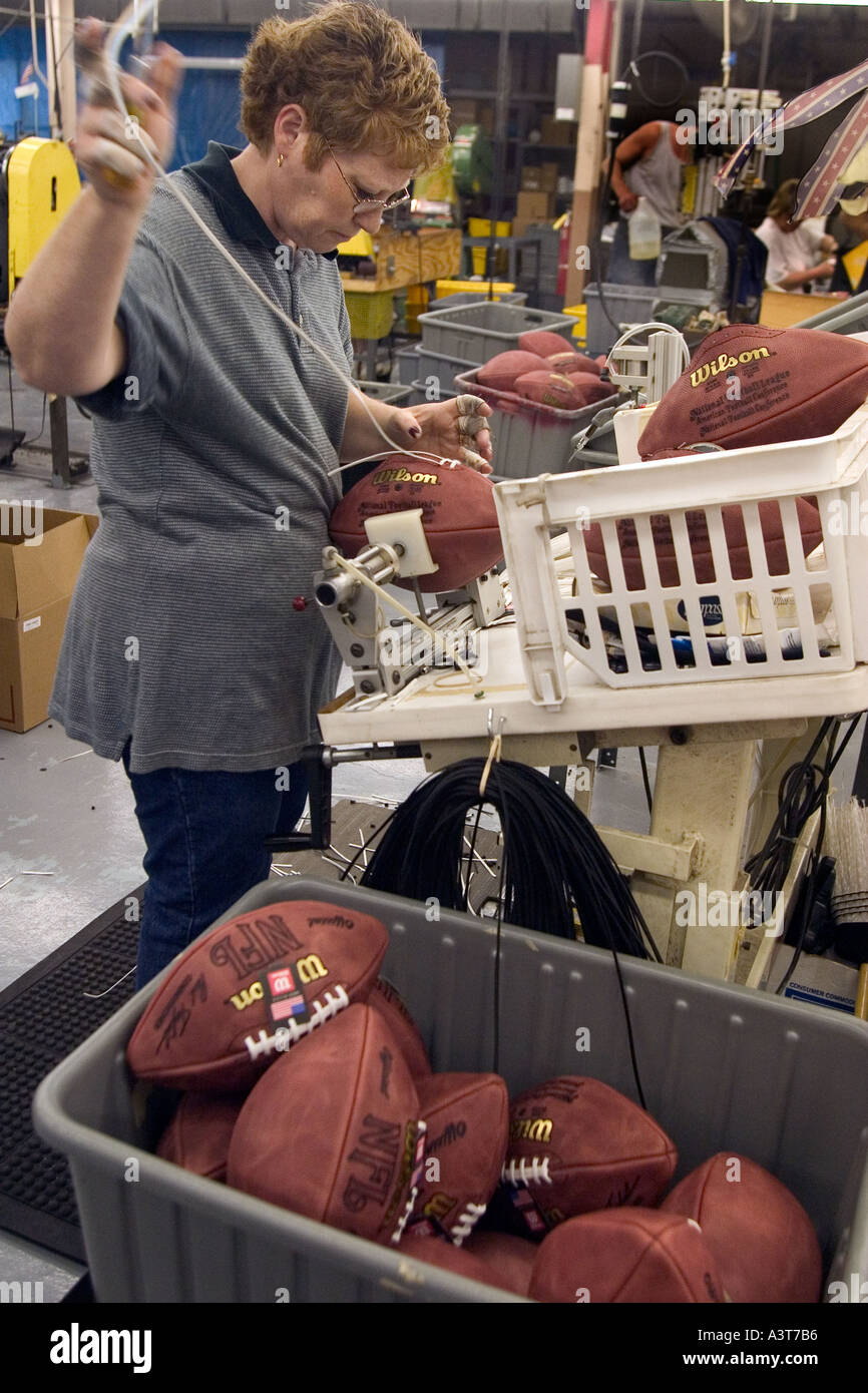 Workers manufacture footballs at Wilson Sports factory Stock Photo - Alamy
