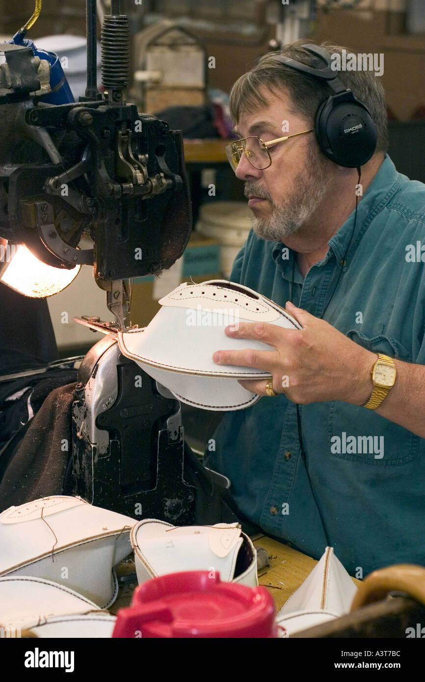 Workers manufacture footballs at Wilson Sports factory Stock Photo - Alamy