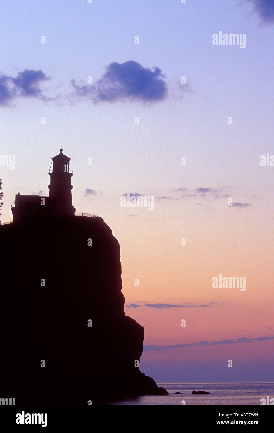 THE SPLIT ROCK LIGHTHOUSE IS SILHOUETTED AT DAWN AT SPLIT ROCK ...