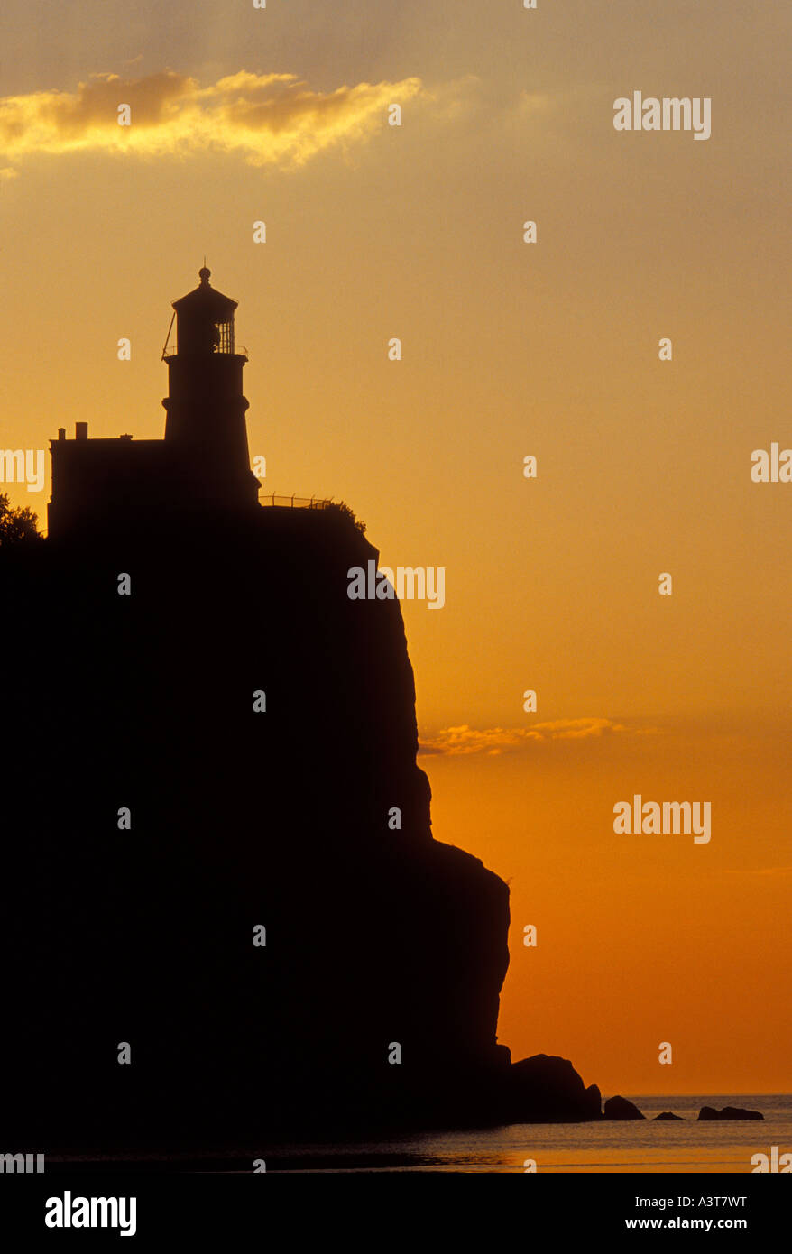 THE SPLIT ROCK LIGHTHOUSE IS SILHOUETTED AT DAWN AT SPLIT ROCK ...